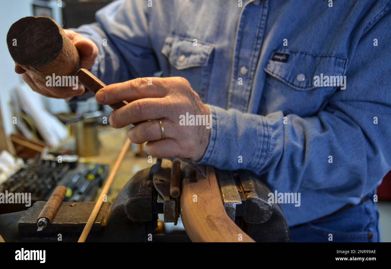 In this Sunday, Feb. 2, 2020 photo, Sam Gorham works on a longrifle in ...