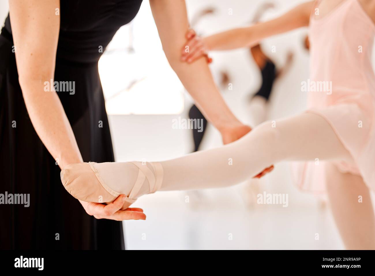 Closeup, ballet and coach with girl, support and training for ...
