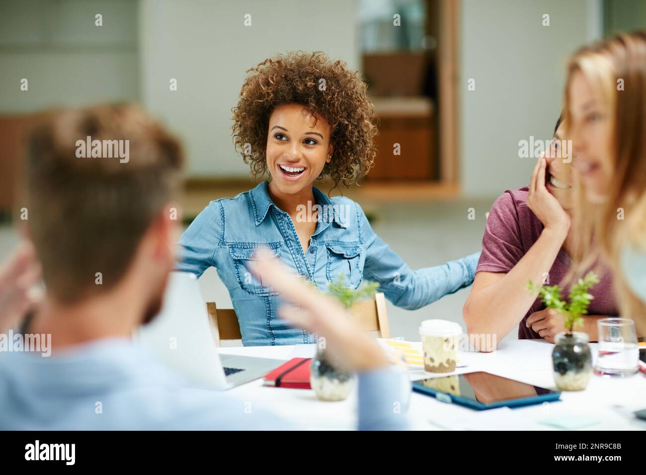 Awesome job team. a group of businesspeople talking together around a ...