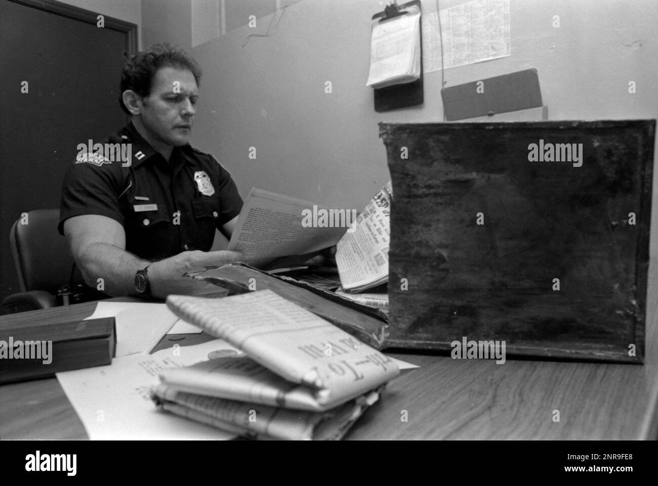 Atlanta police officer Julian Spence looks over the contents of a time ...
