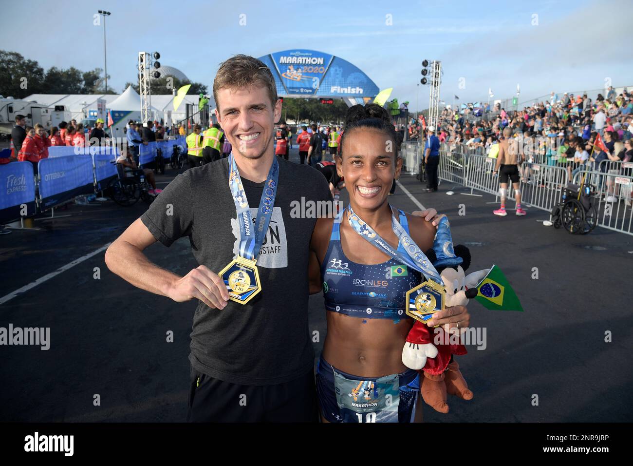 Top male finisher Nick Hilton, left, poses with top female finisher ...