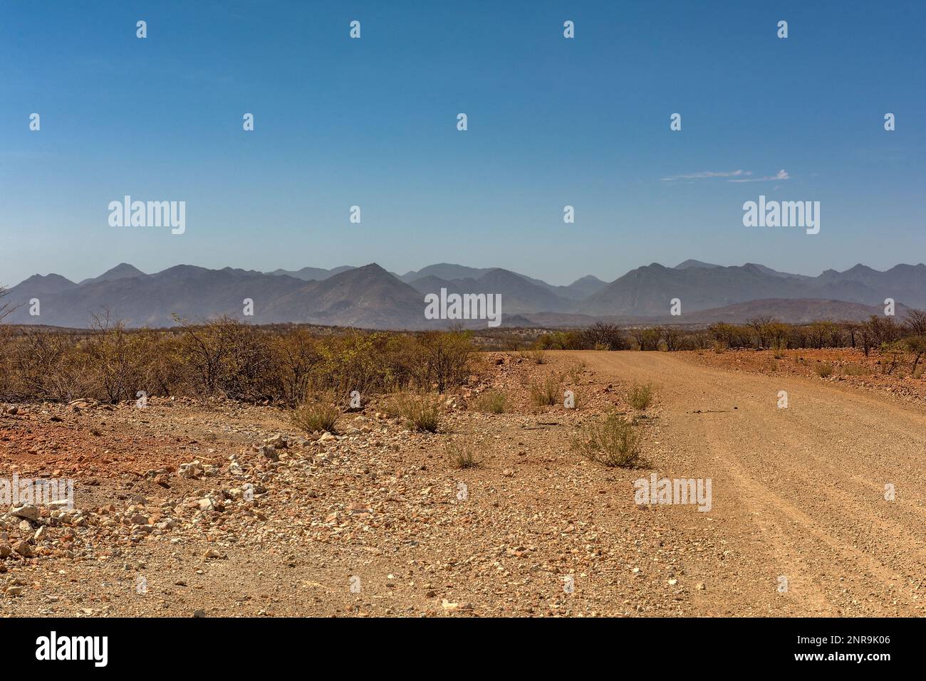 The dusty gravel road along the Kunene River in northern Namibia Stock ...