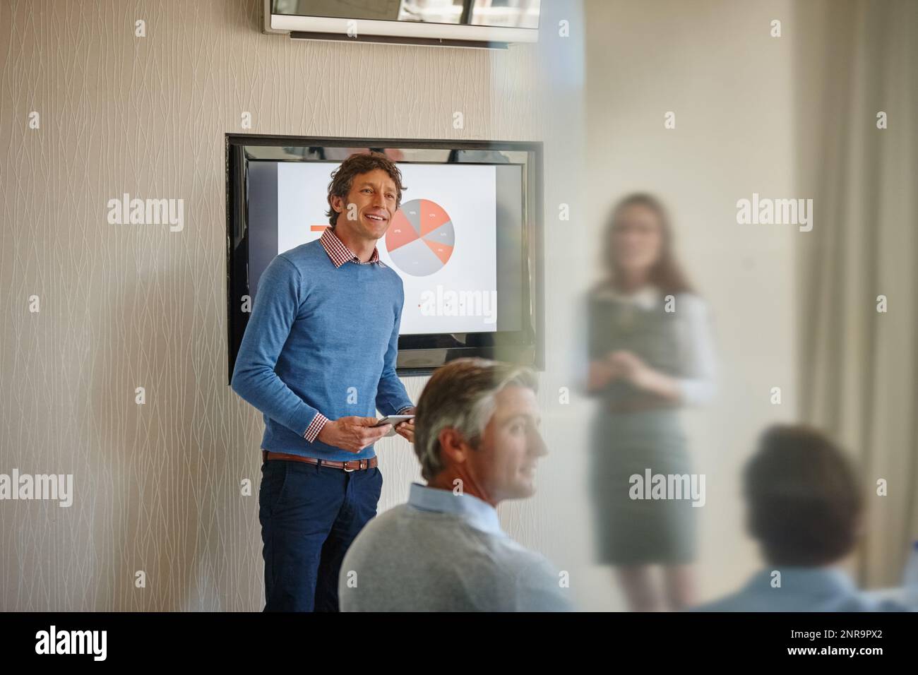 Question and answer time. a businessman giving a presentation to his ...