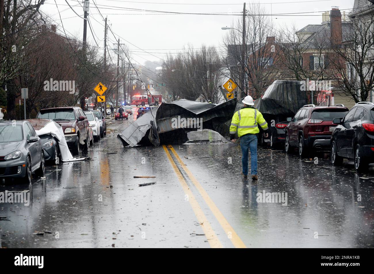 Emergency responders survey damage on West Main Street after a powerful ...