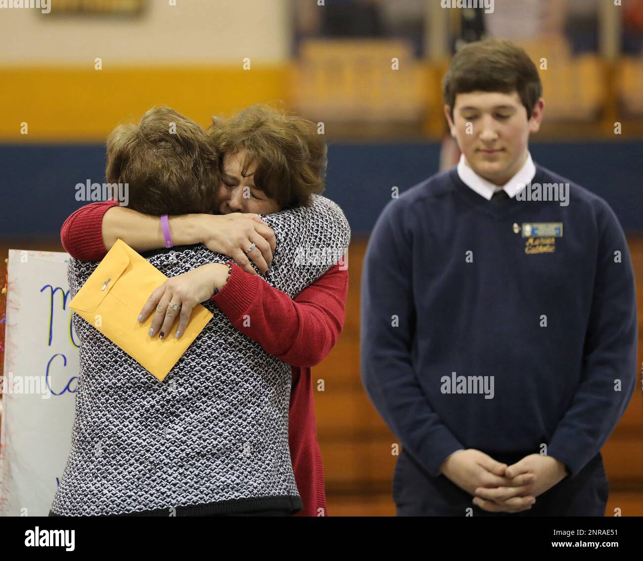 Renee McCarthy-Tessitore hugs Marian Catholic Theology teacher, Mary ...