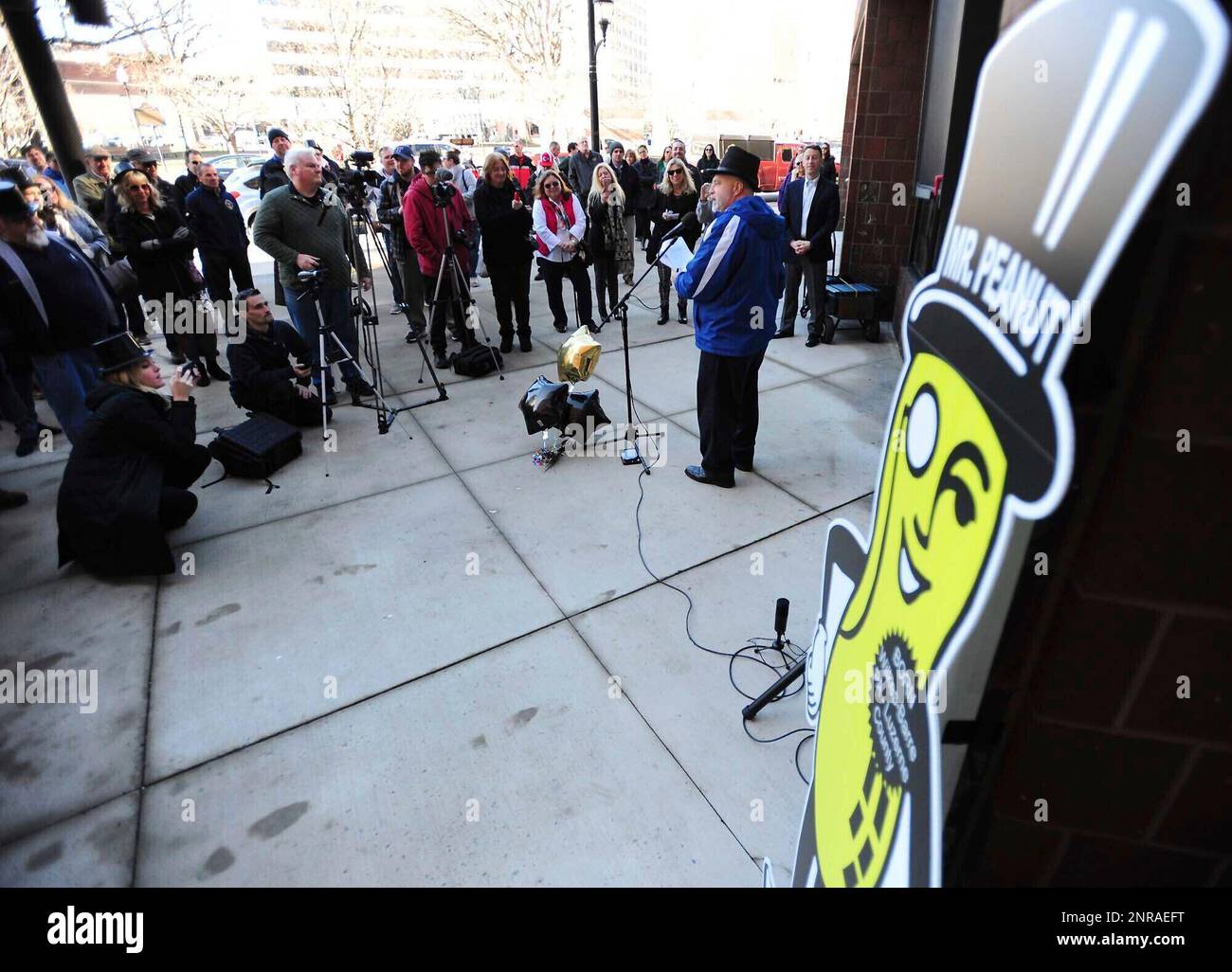 Ted Wampole donning a top hat, offers remarks during a Mr. Peanut ...