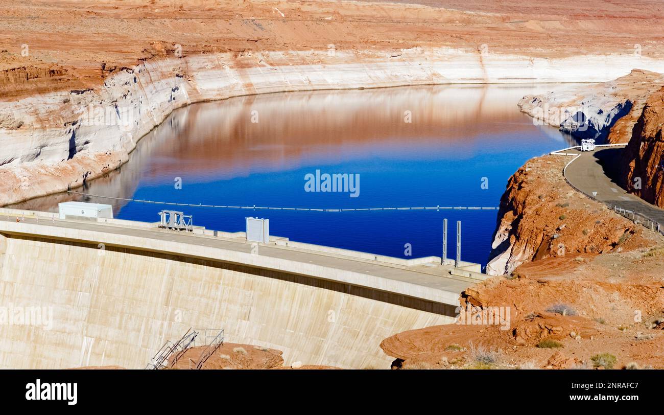 Water dam with blue water surround with red hills Stock Photo - Alamy