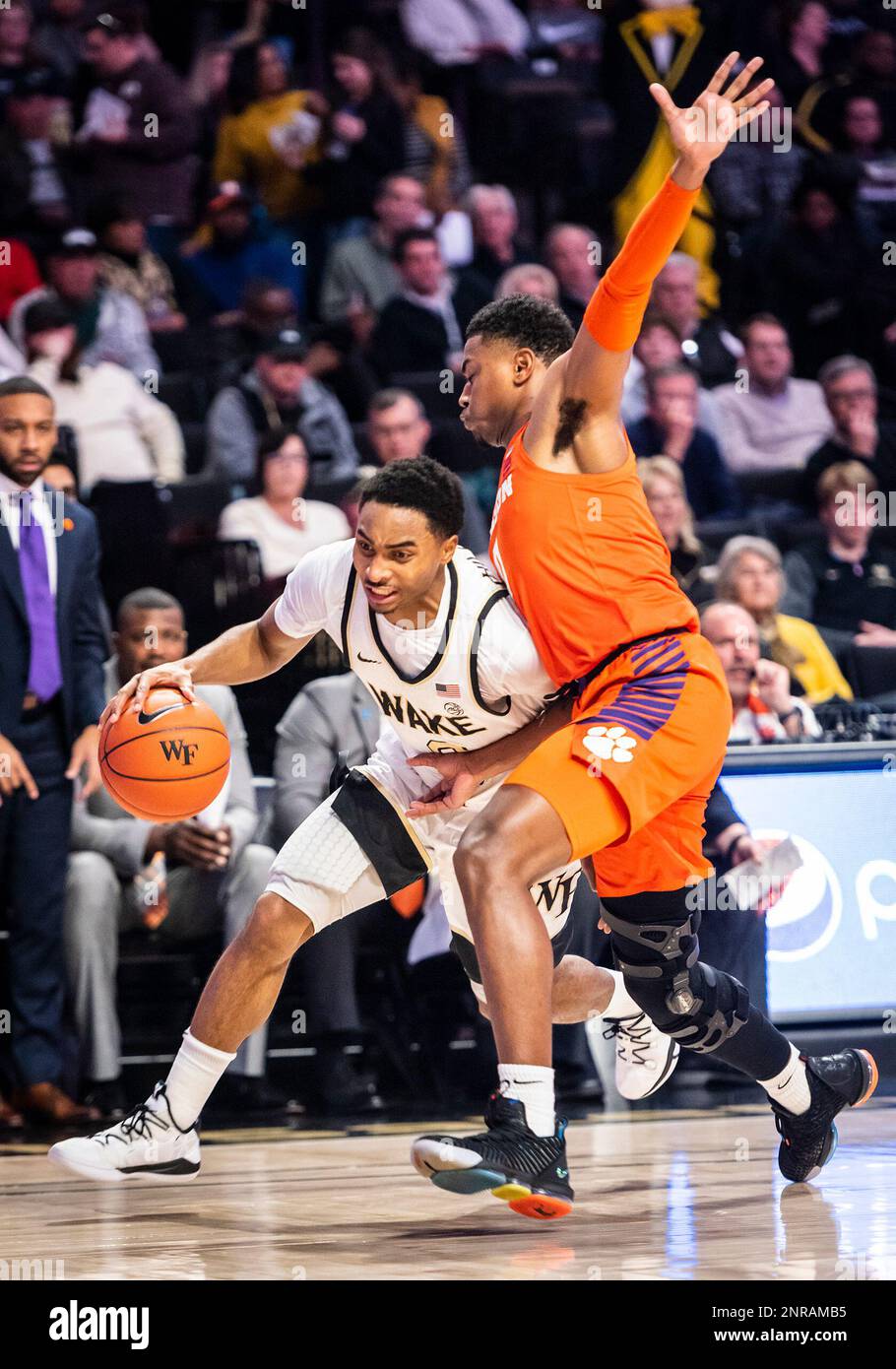 Wake Forest guard Brandon Childress (0) drives as Clemson guard Clyde ...
