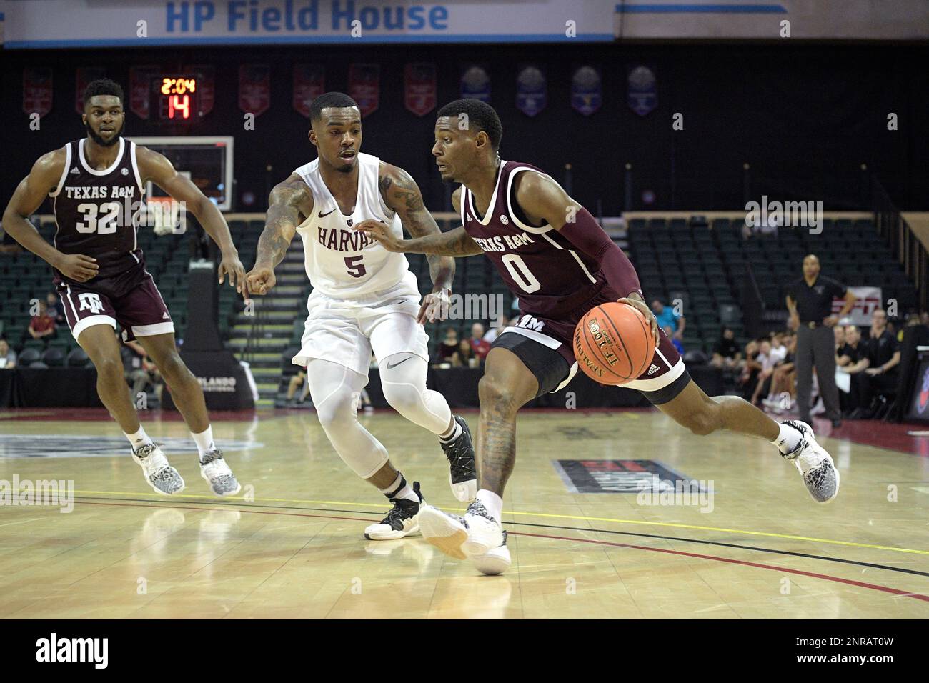 Texas A&M guard Jay Jay Chandler (0) drives to the basket in front of ...