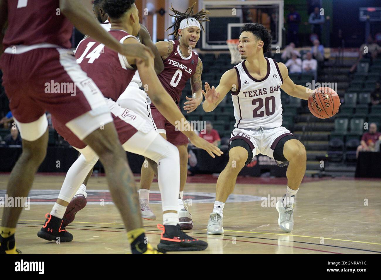 Texas A&M guard Andre Gordon (20) controls the ball in front of Temple ...