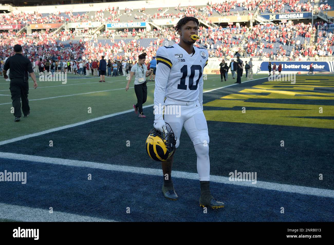 Michigan linebacker Anthony Solomon (10) leaves the field after the ...