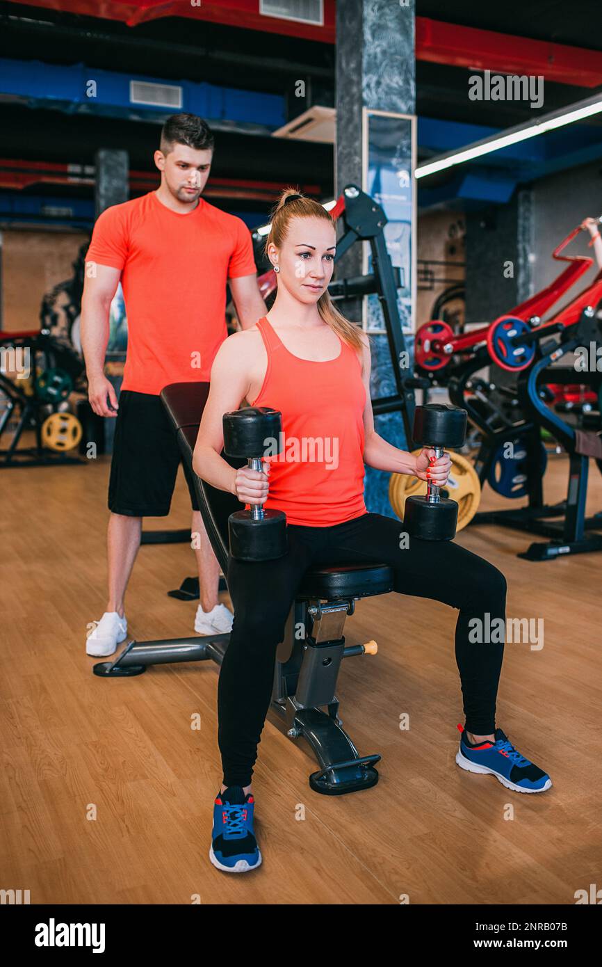 Dumbbells training workout woman gym concept Stock Photo - Alamy