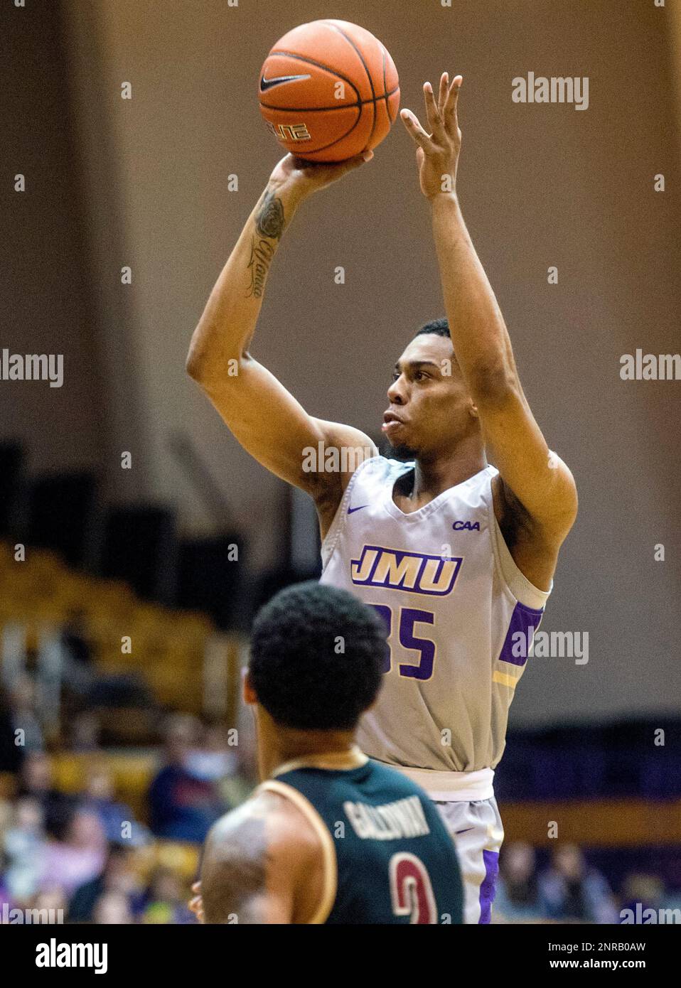 James Madison forward Devon Flowers (35) goes up to shoot against ...