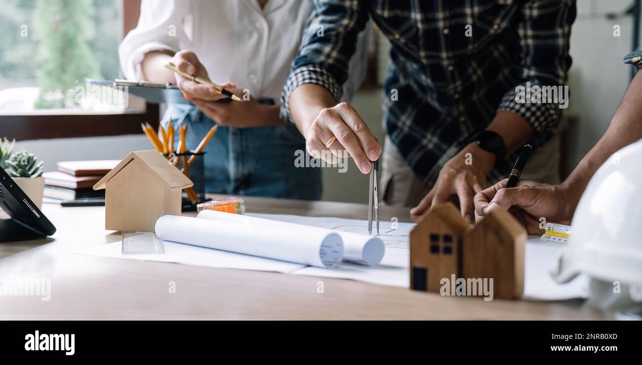 engineer and architect people meeting working and hand drawing on ...
