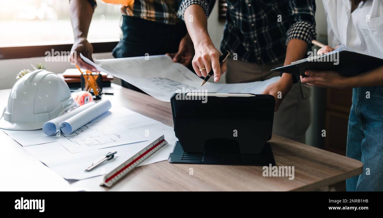 People adviser construction site engineers. working drawing on ...