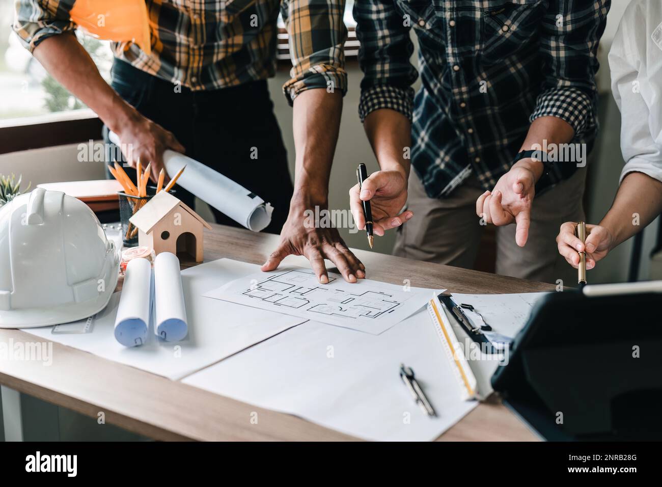 People adviser construction site engineers. working drawing on ...