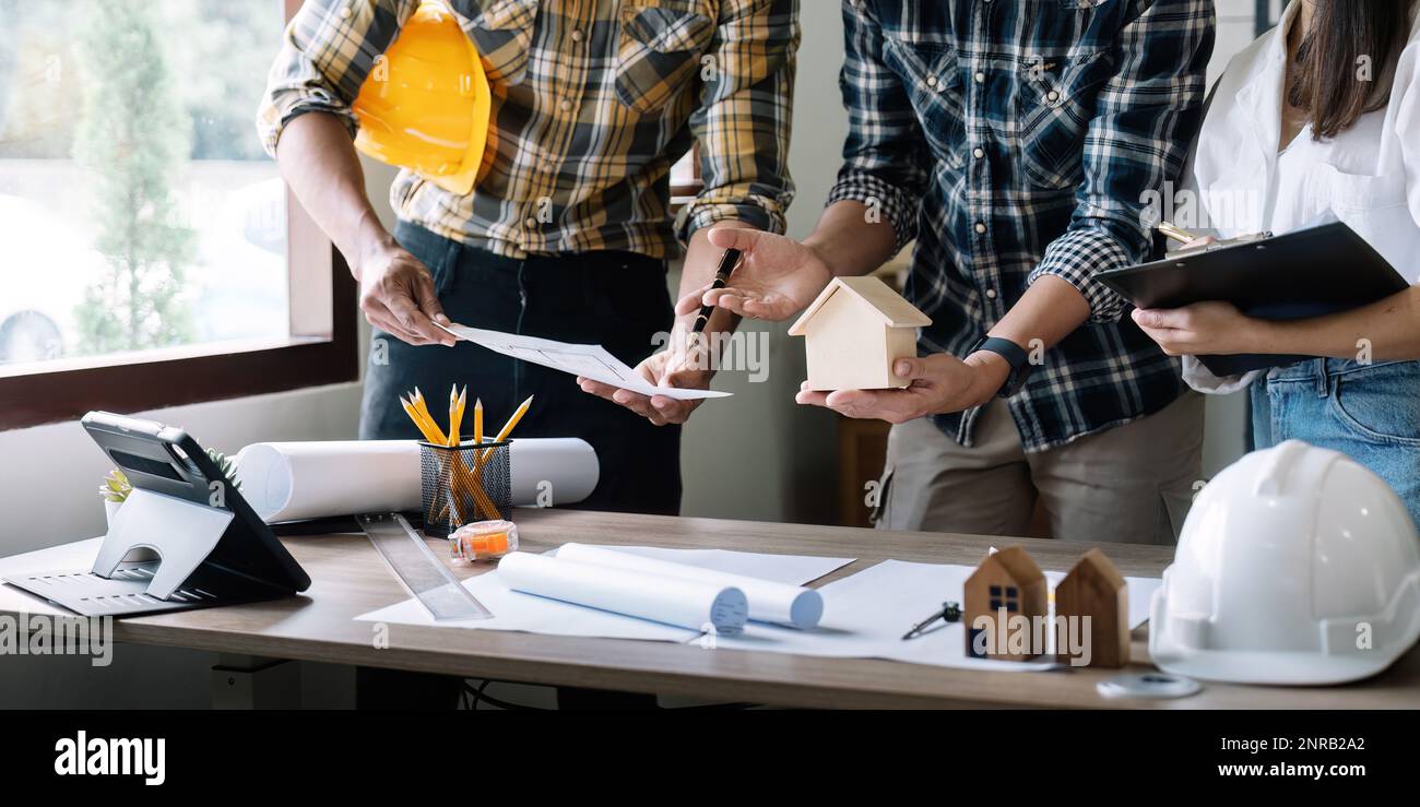 architect and engineer inspect housing estate building to success construction plan before send ...