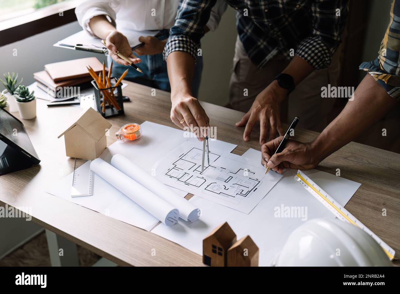 engineer and architect people meeting working and hand drawing on ...