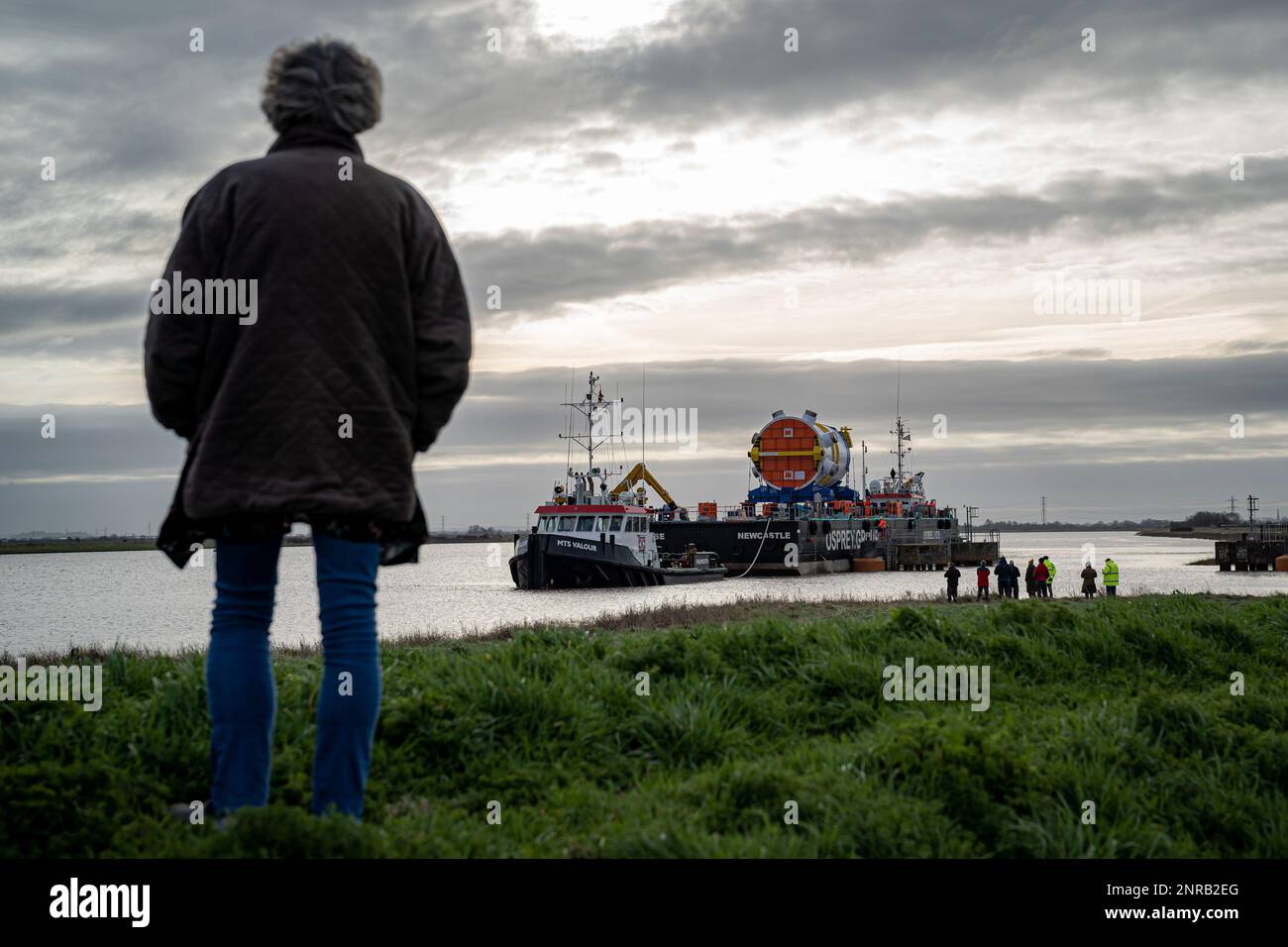 People watch as the first new nuclear reactor for a British power ...