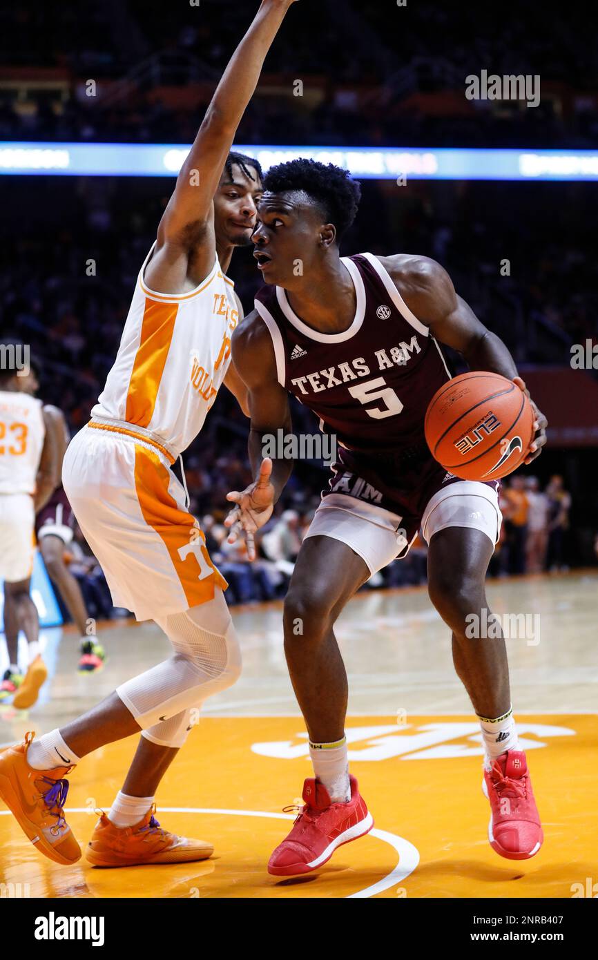 Texas A&M forward Emanuel Miller (5) works for a shot as he's defended ...