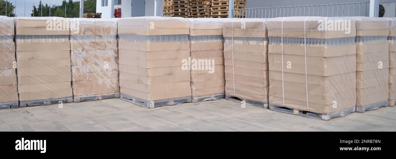 Rows of boxes and pallets in warehouse and production warehouse Stock ...