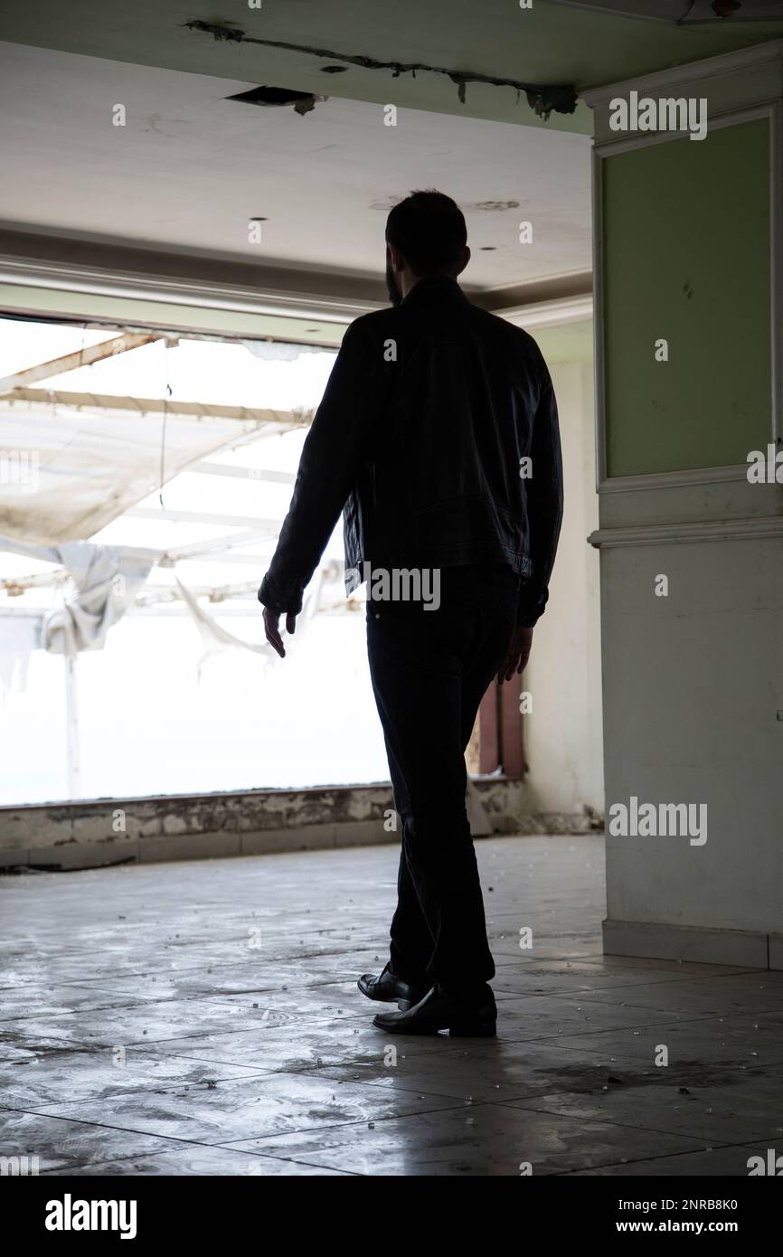 Anonymous man window hi-res stock photography and images - Alamy