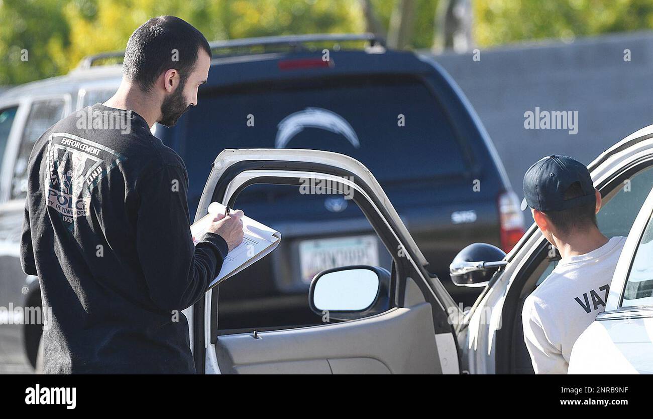Clipboard in hand, instructor Jordan Smith, left, with Yuma Police ...