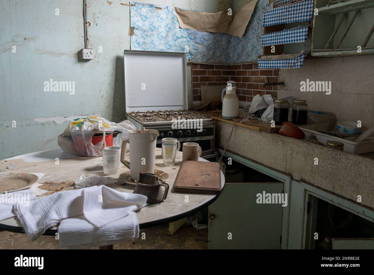 Deserted and abandoned house kitchen with kitchenware on the room ...