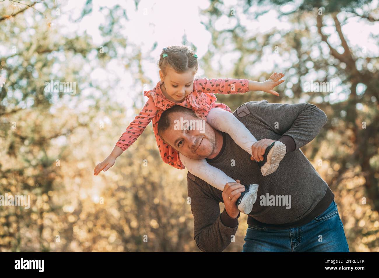 Happy Father And Child Having Fun Playing Outdoors. Smiling Young Dad ...