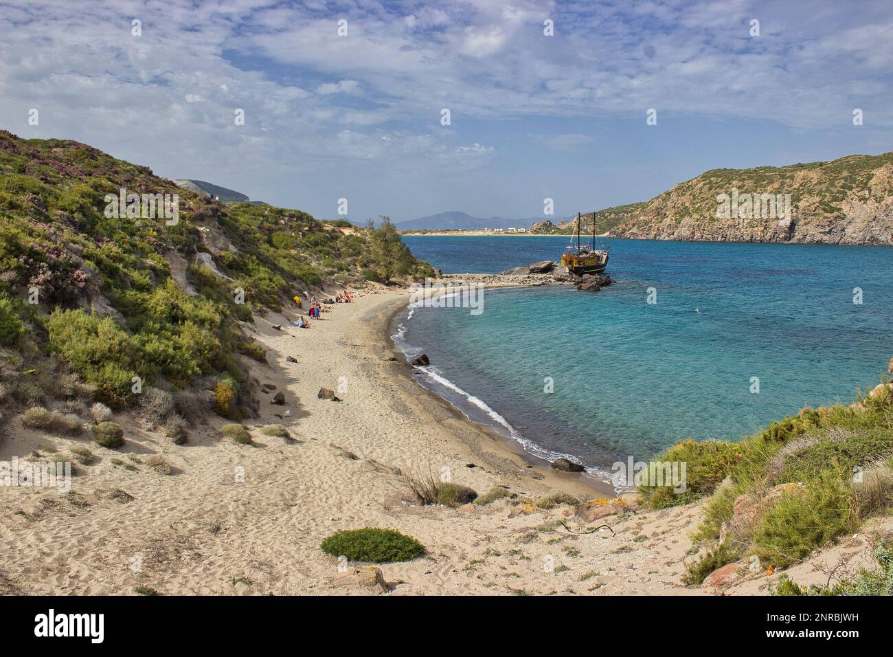 Idyllic panoramic view of a beach bay in Cyprus. The turquoise blue bay is surrounded by beach ...