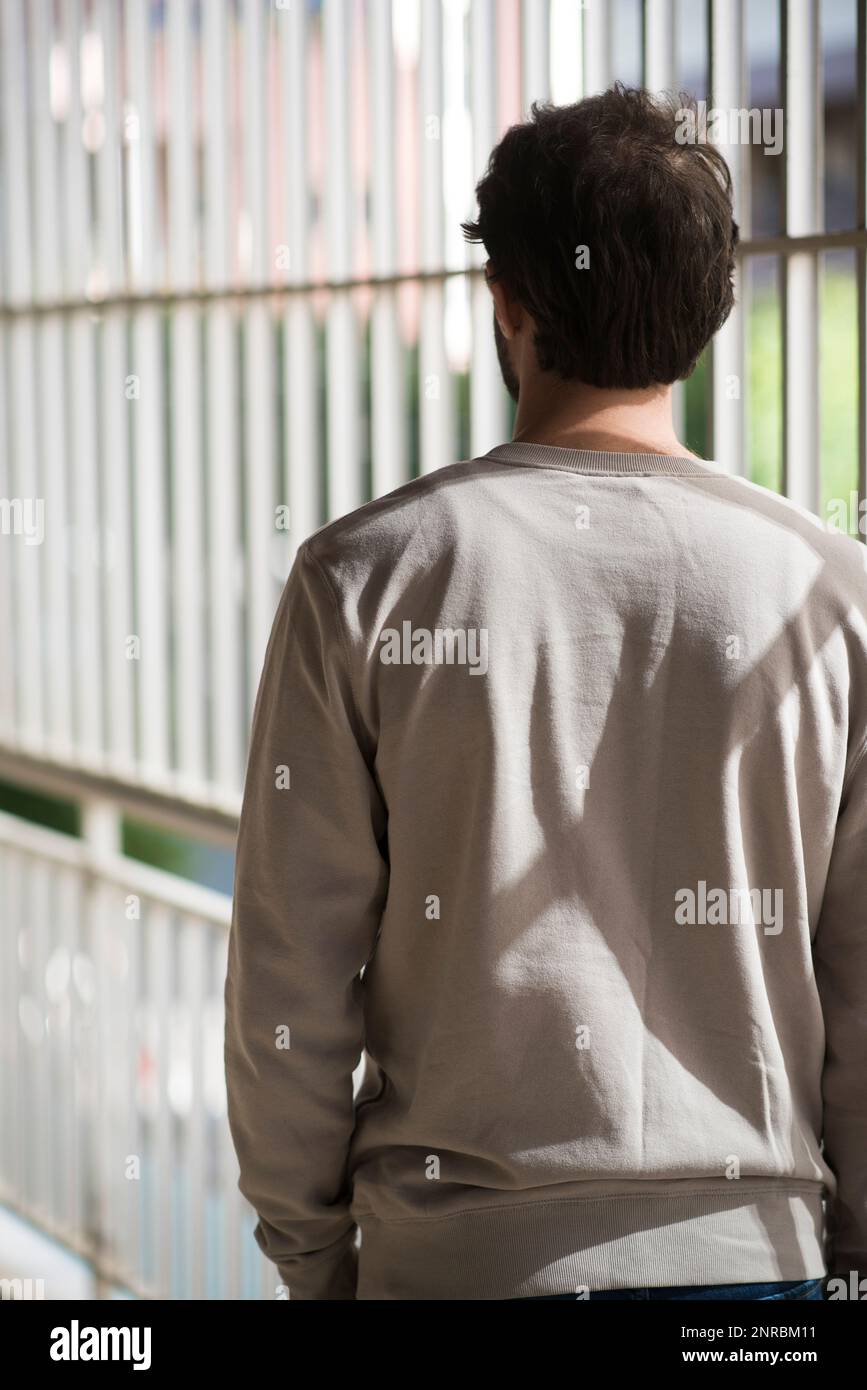 Man behind bars hi-res stock photography and images - Alamy