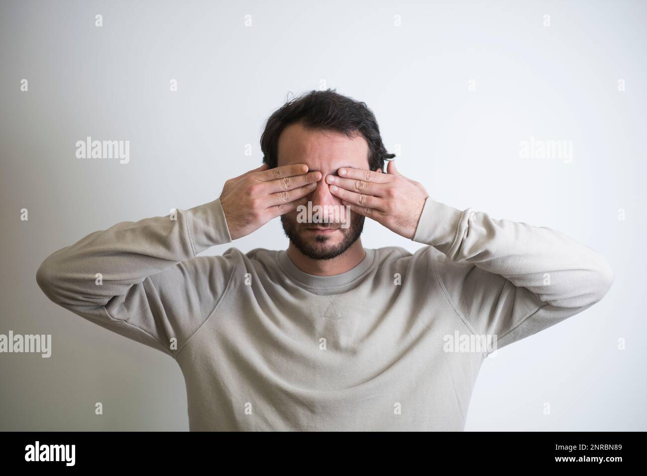Hiding eyes hi-res stock photography and images - Alamy