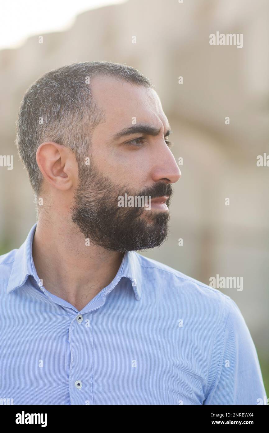 Middle Eastern man looking away Stock Photo - Alamy