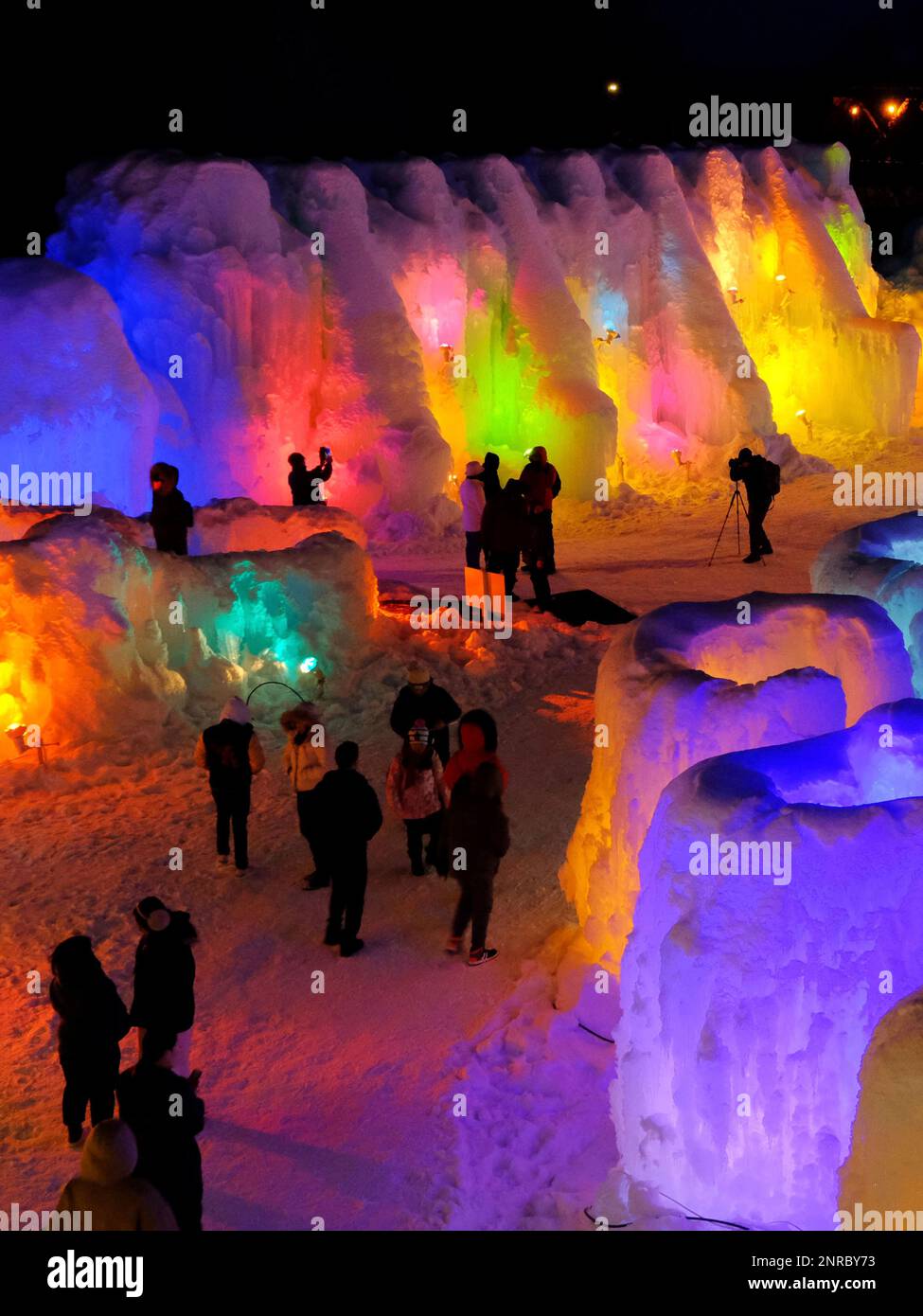 People enjoy snow statues, ice pillars, ice tunnels, ice domes and ice ...