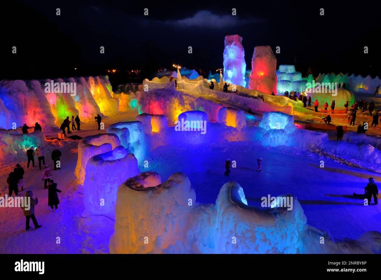 People enjoy snow statues, ice pillars, ice tunnels, ice domes and ice ...