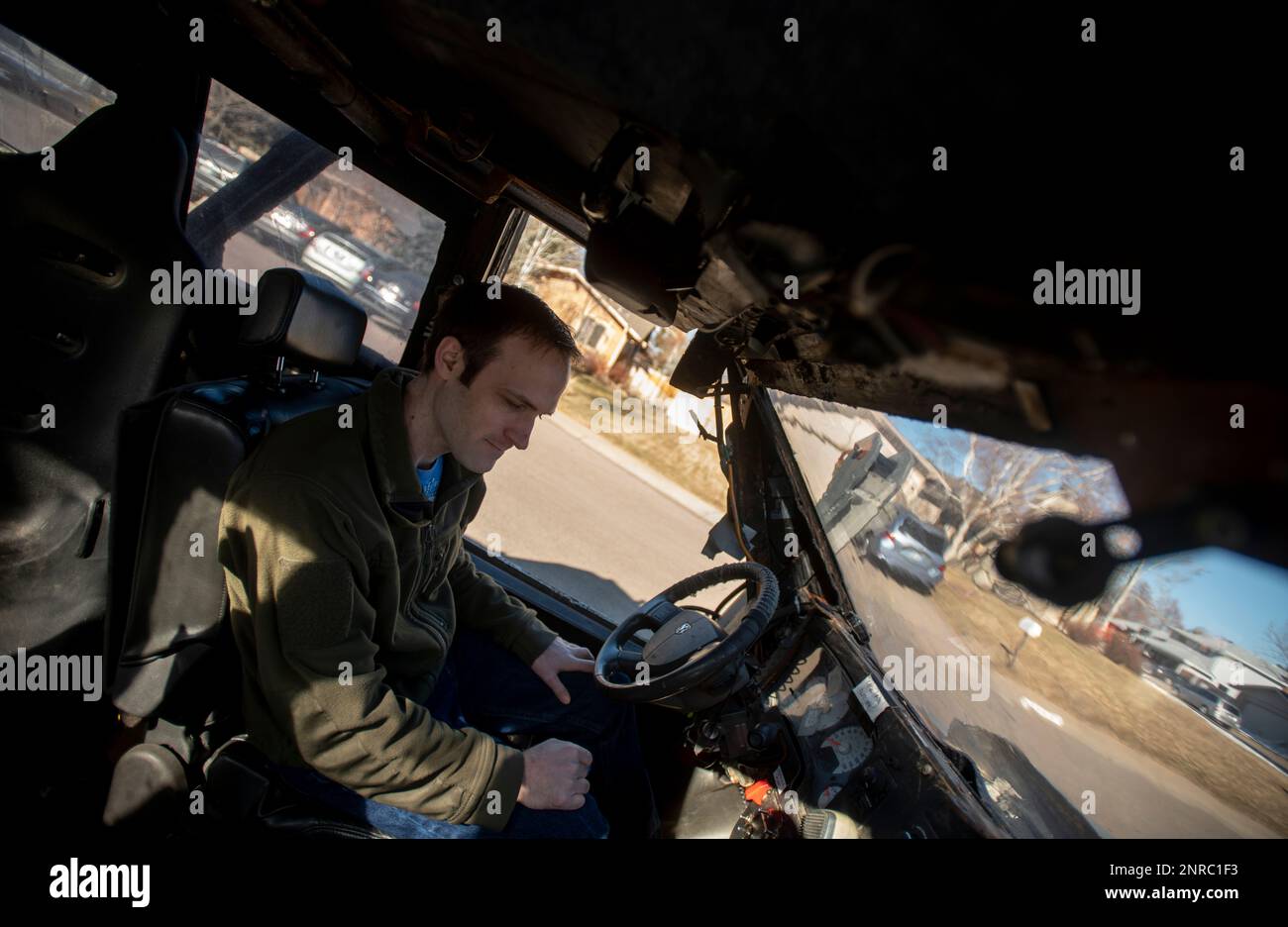 Storm chaser Ryan Shepard sits in the driver's seat while explaining a ...