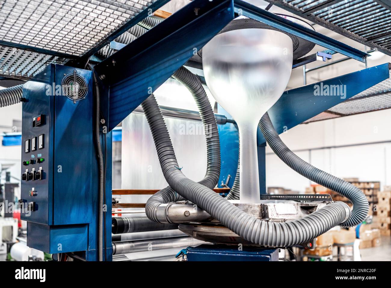 production of plastic packaging in a factory on an automated line Stock ...