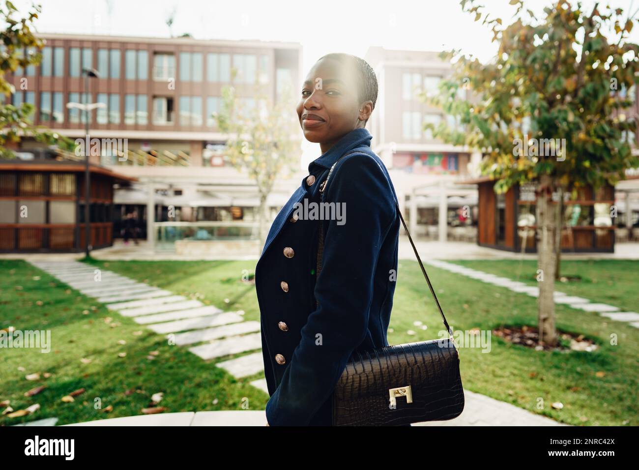 Stylish african female student near university campus Stock Photo - Alamy