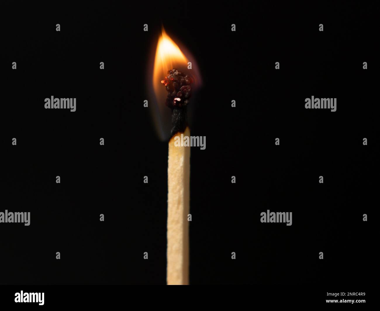 Burning match on a black background. Flame from a lit match. Close-up ...
