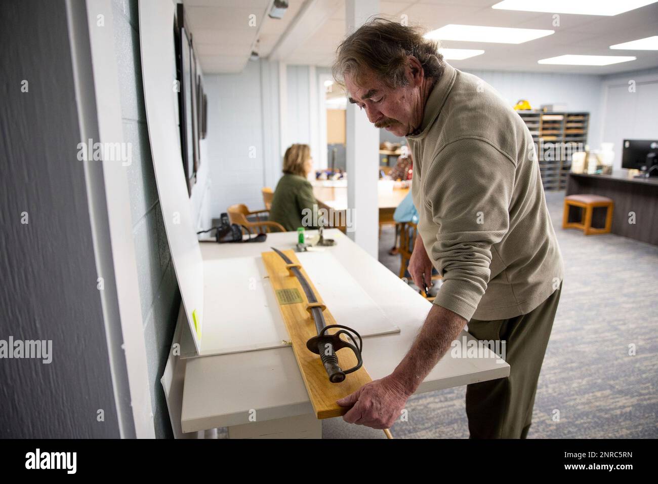 J. Terry Dougherty, curator of the Spotsylvania County Museum, examines ...