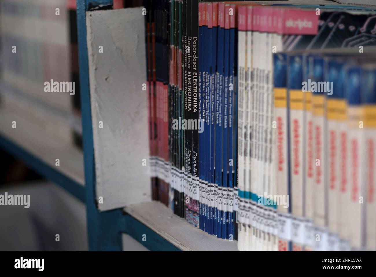 Books Are Arranged Neatly On An Iron Shelf, In The Air Belo Village ...