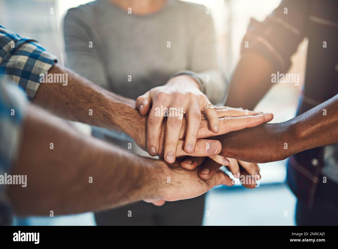 Team hands together form unity hi-res stock photography and images - Alamy