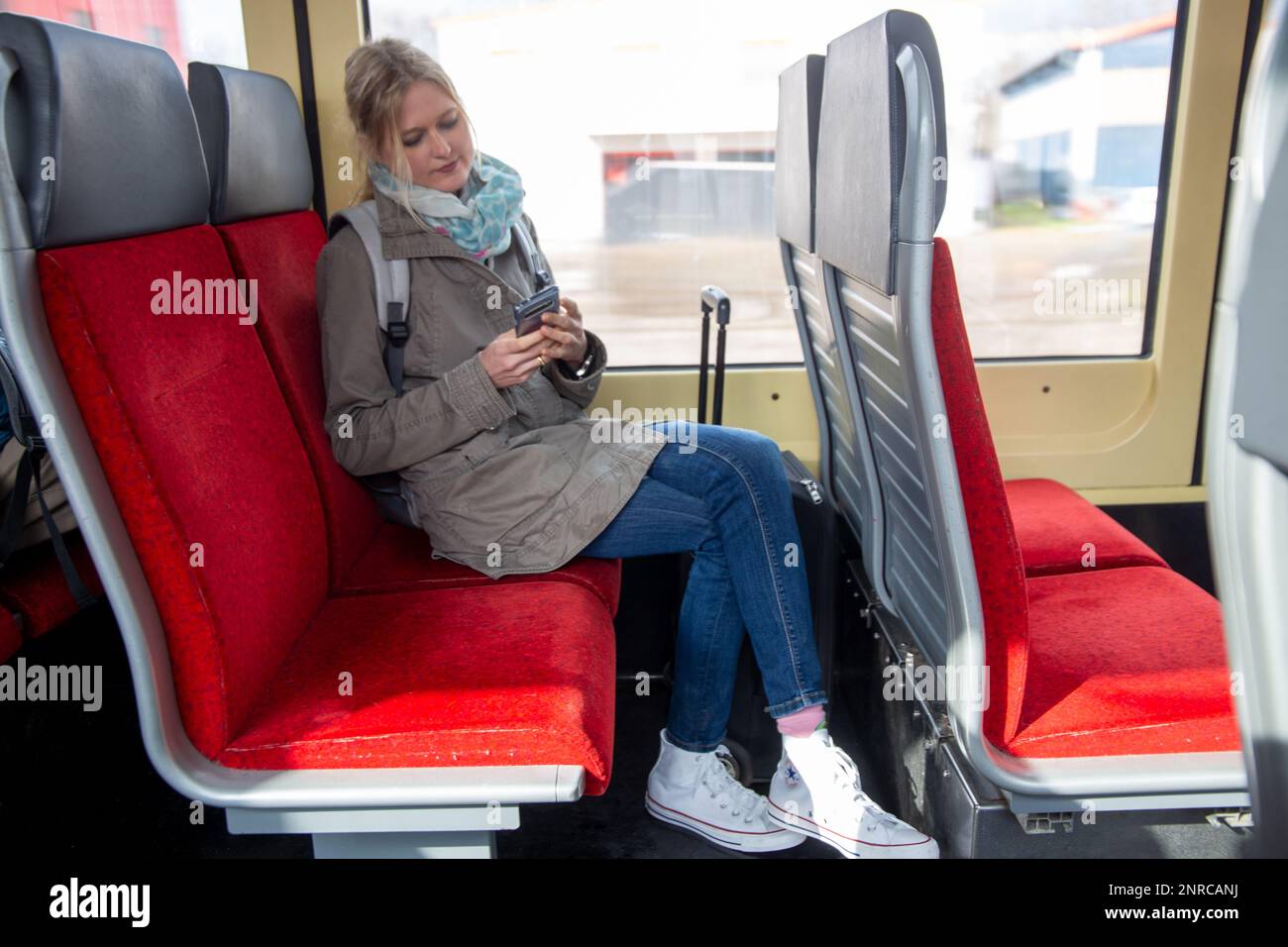 Young woman with white Chucks in a train (Model released Stock Photo ...