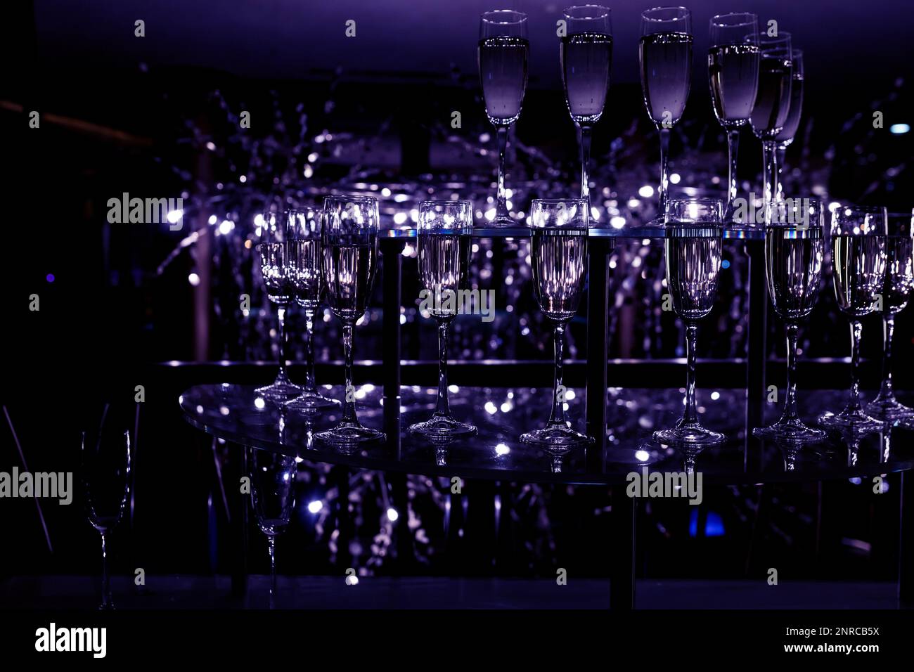 lot of wine glasses with delicious champagne at the bar. Alcohol ...