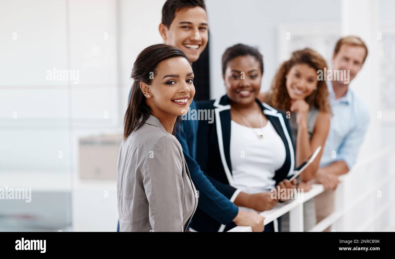 We are a great team. a diverse group of colleagues standing together in ...