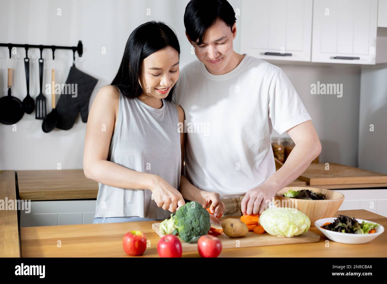 Asian couple cooking home hi-res stock photography and images - Alamy