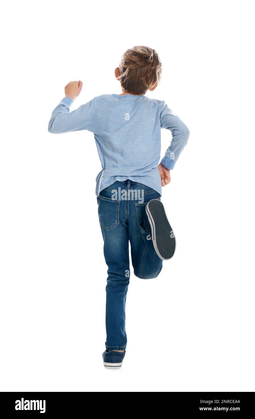 Little boy running on white background, back view Stock Photo - Alamy