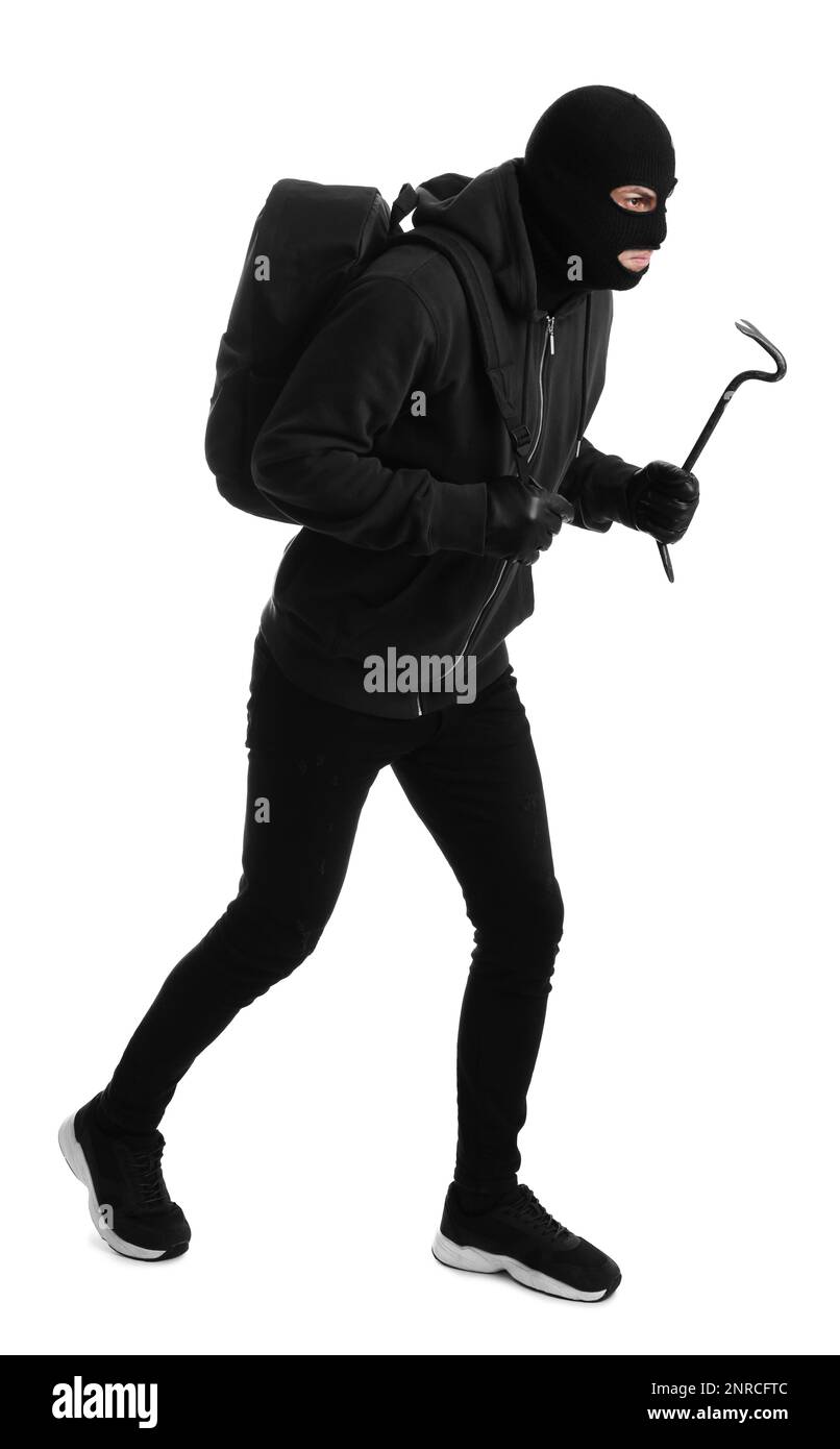 Man wearing black balaclava with backpack and crowbar on white ...