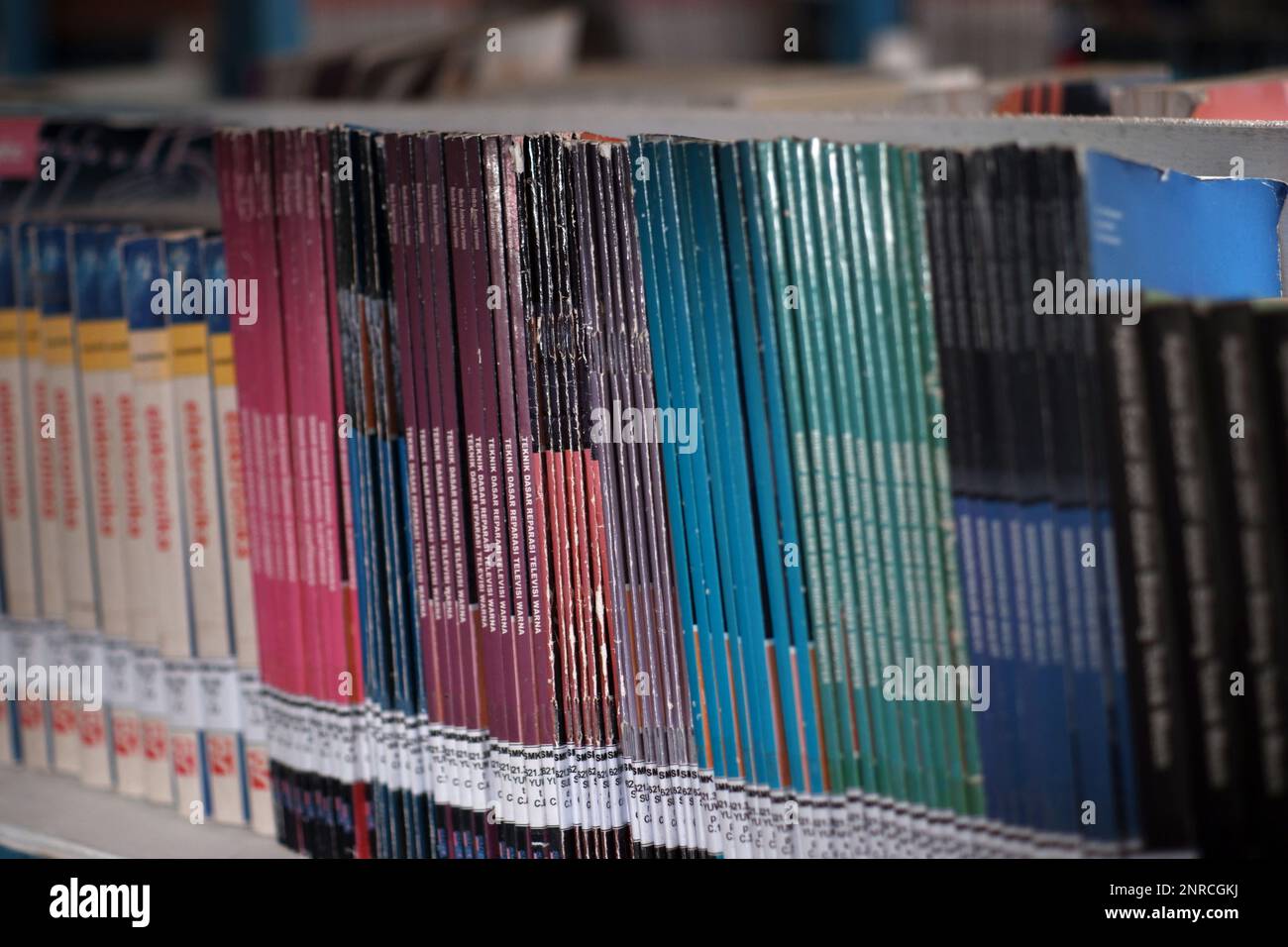 School Textbooks Neatly Arranged On An Iron Shelf, In The Air Belo ...