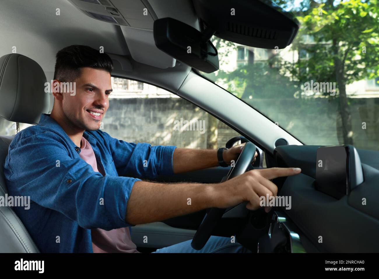 Man using navigation system while driving car Stock Photo - Alamy Man using navigation system while driving car Stock Photo - Alamy